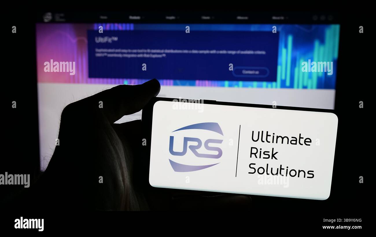 In this photo illustration, a person is holding a mobile phone with the ...