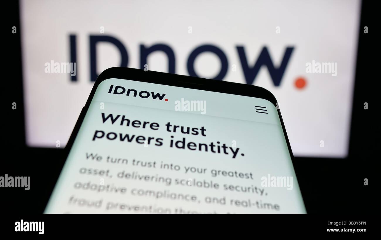 In this photo illustration, a mobile phone with the webpage of identity verification company ...