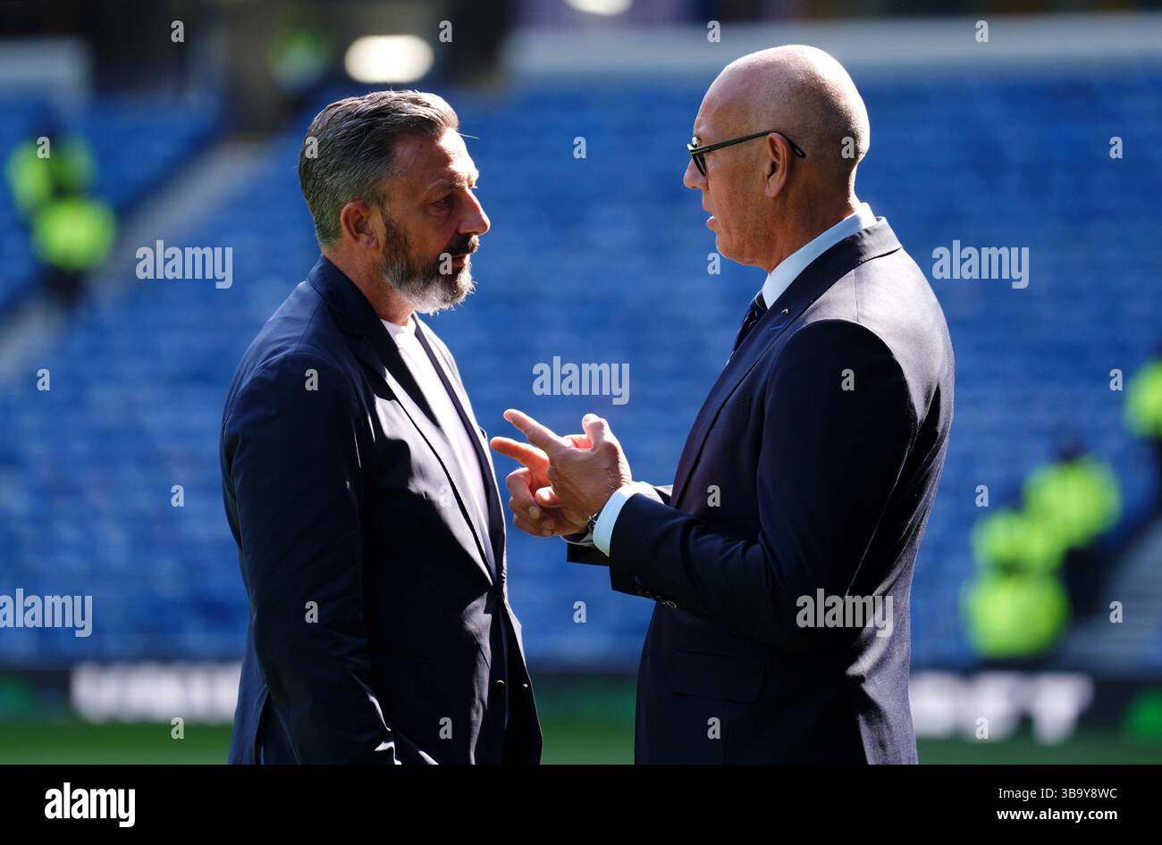 Kirmarnock manager Derek McInnes (left) speaks to former Rangers player ...