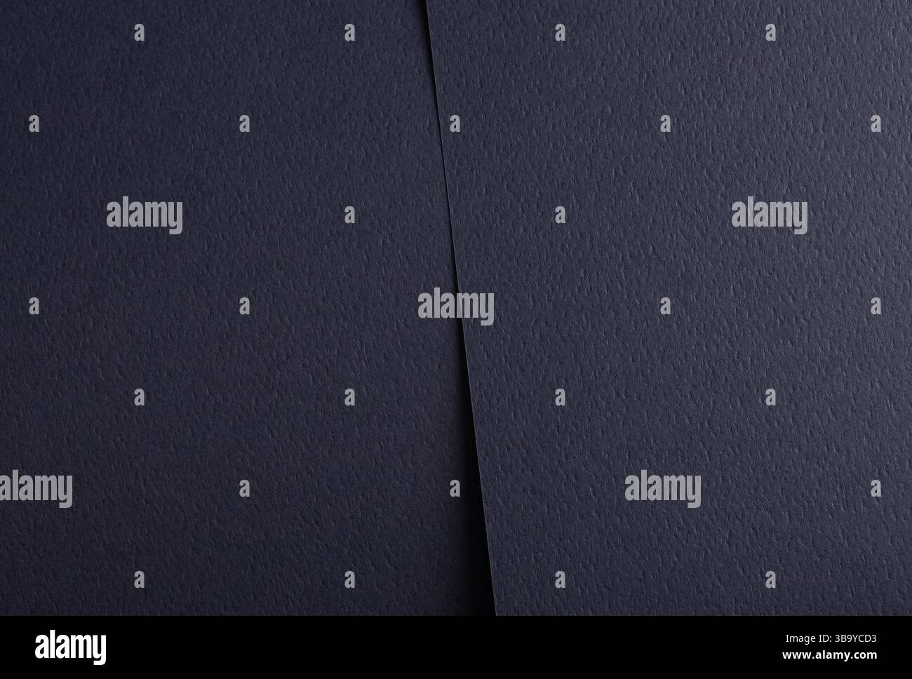 Paper texture with dark blue tone, clean matte surface and perforated ...