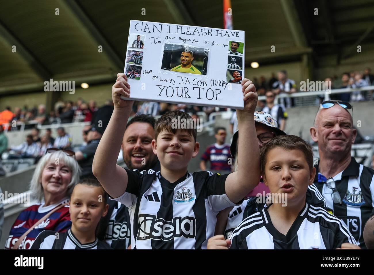 A Newcastle fan with a home made banner for Jacob Murphy of Newcastle ...