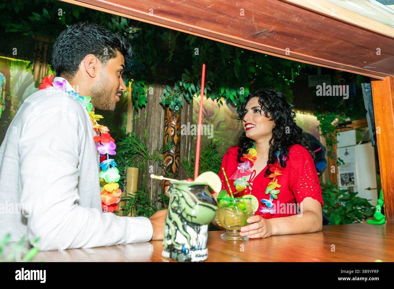 Man woman wearing leis hi-res stock photography and images - Alamy