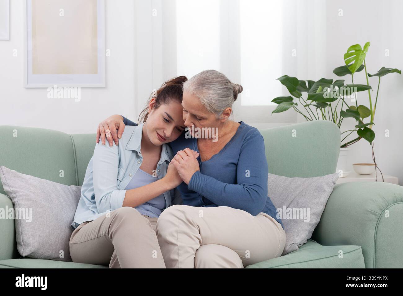 Caring elderly grandmother hugs hi-res stock photography and images - Alamy