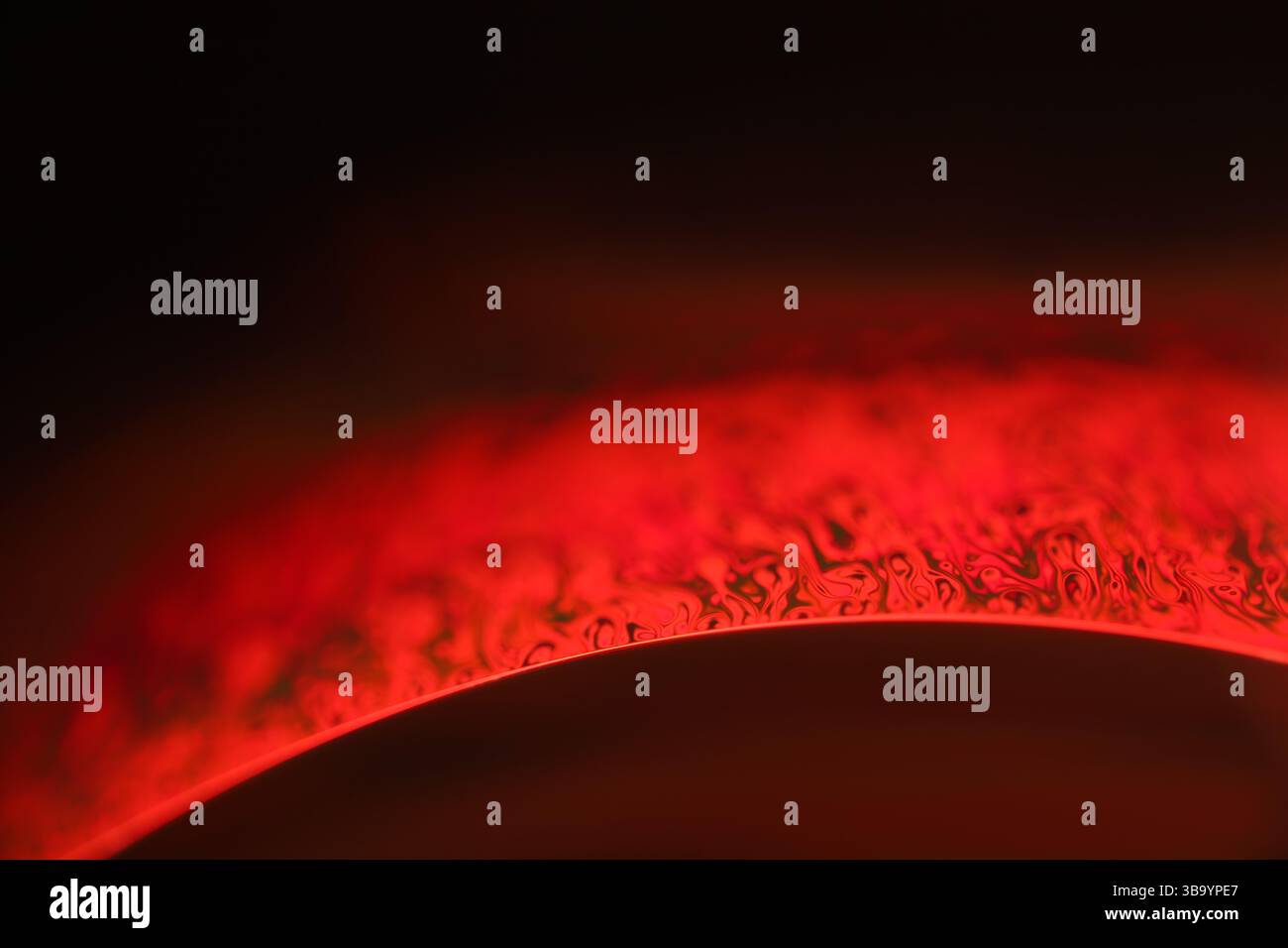 Red reflections of liquid in macro, red liquid surface, bubbles in ...