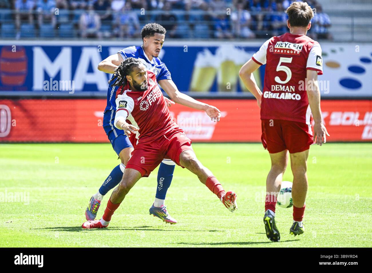 Gent, Belgium. 11th May, 2025. Gent's Aime Omgba and Antwerp's Jairo ...