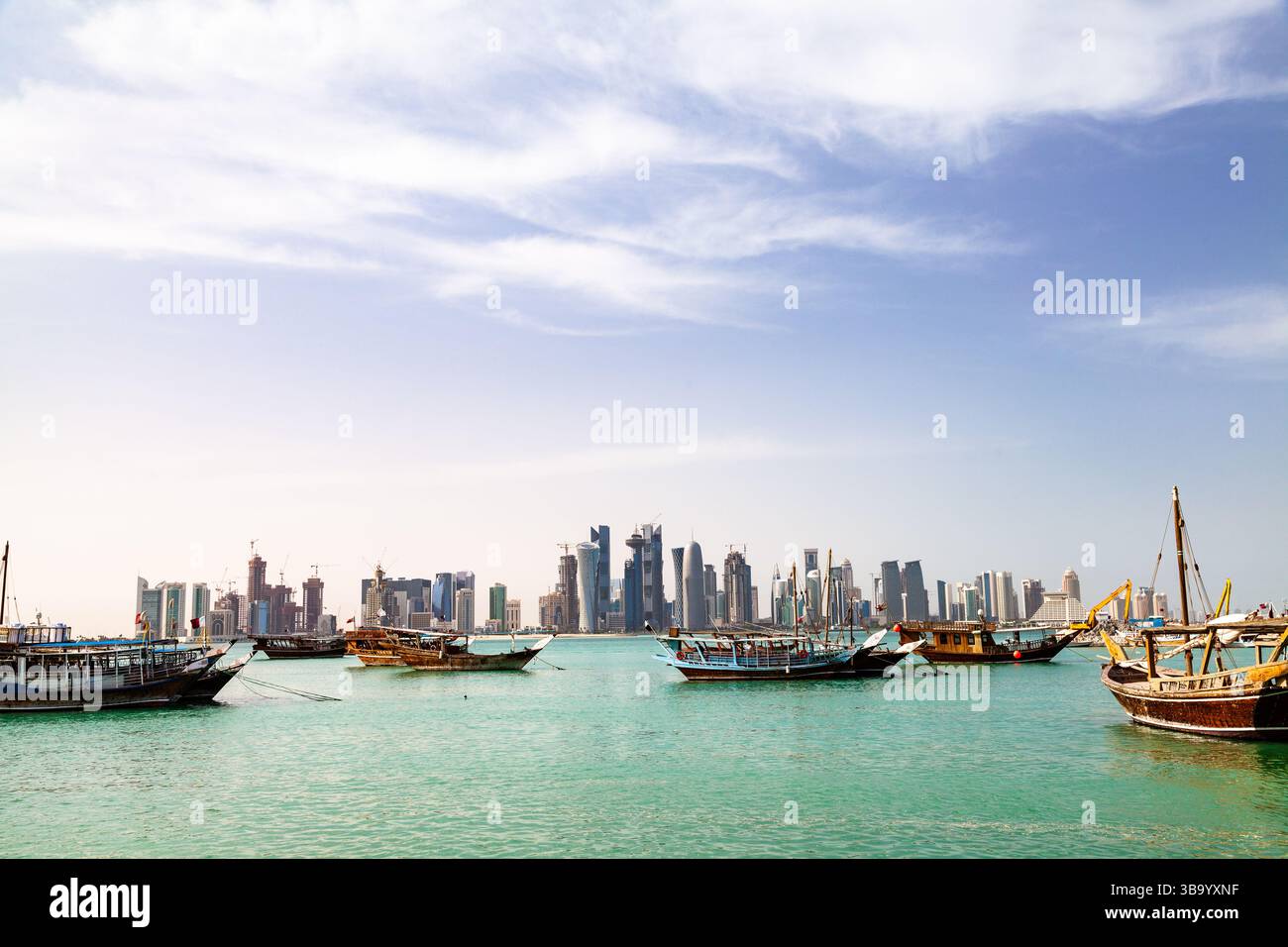 Beautiful Doha Skyline View with Traditional Wooden Boats with Floating ...