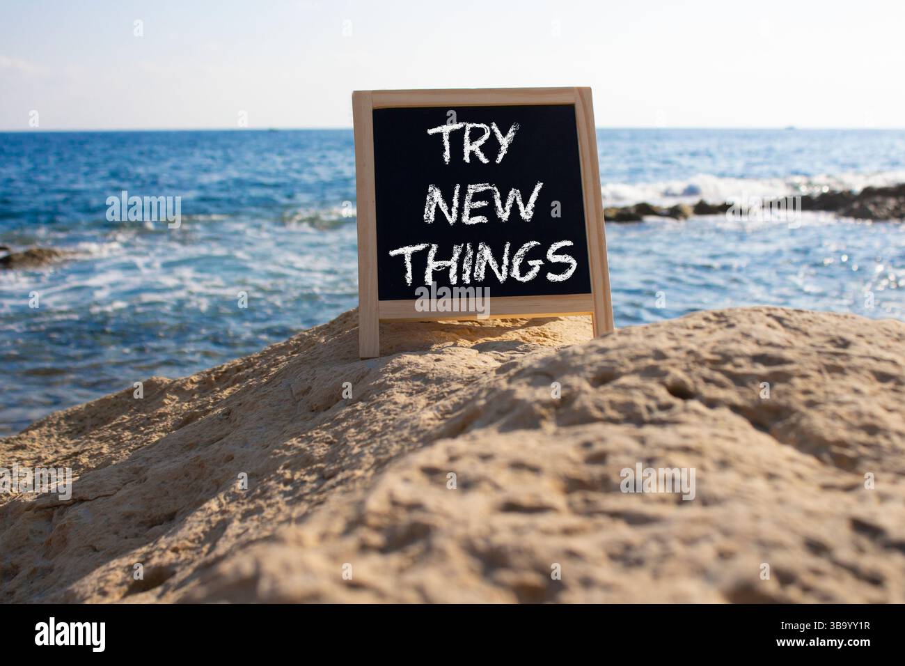 Try new Things symbol. Concept words Try new Things on black chalk ...