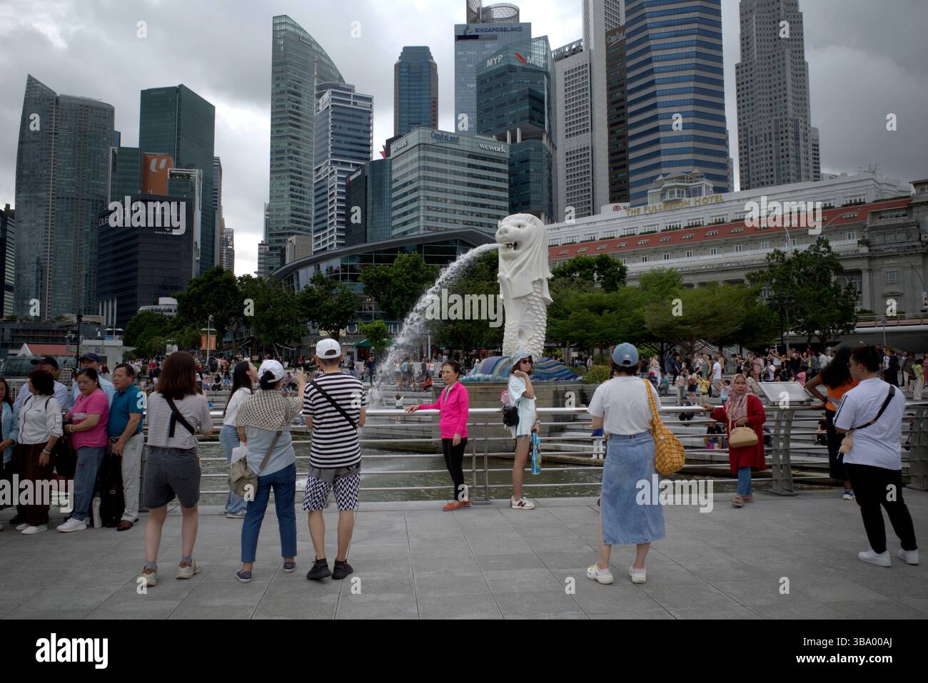 Singapore - 29 November 2024: Merlion Park, a famous Singapore landmark ...