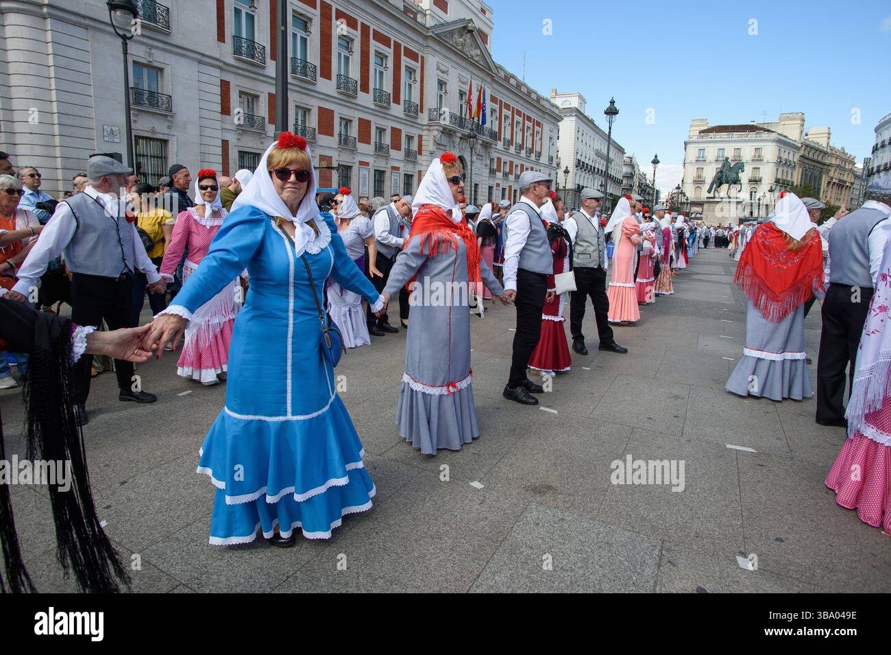 People during the traditional parade Dancing through Madrid, a popular ...