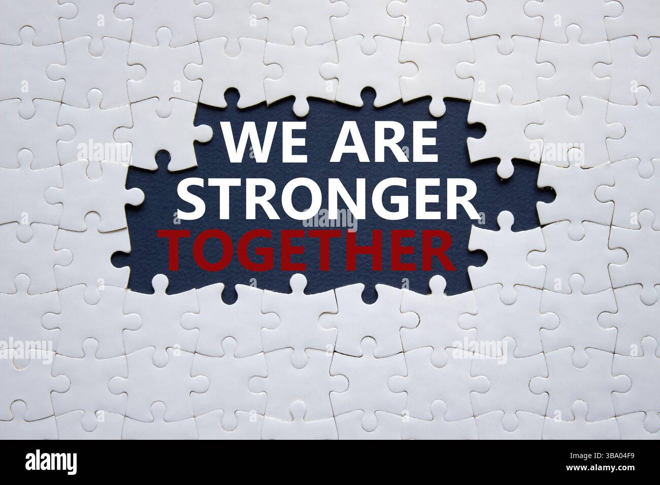 We are stronger together symbol. White puzzle with words We are ...