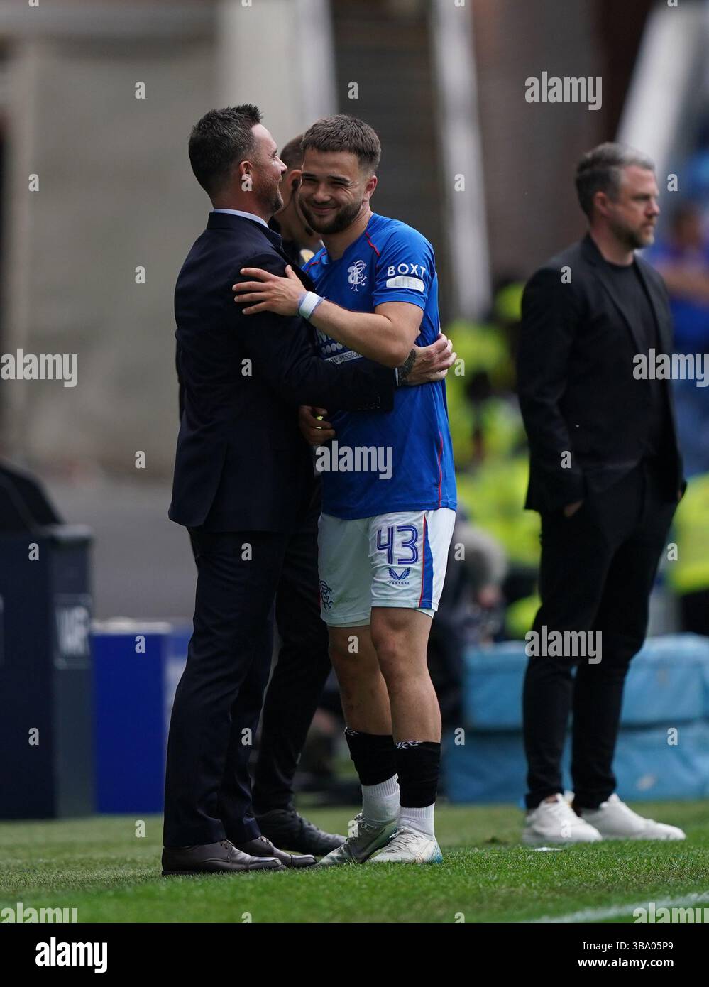 Rangers' Nicolas Raskin with interim manager Barry Ferguson as he ...
