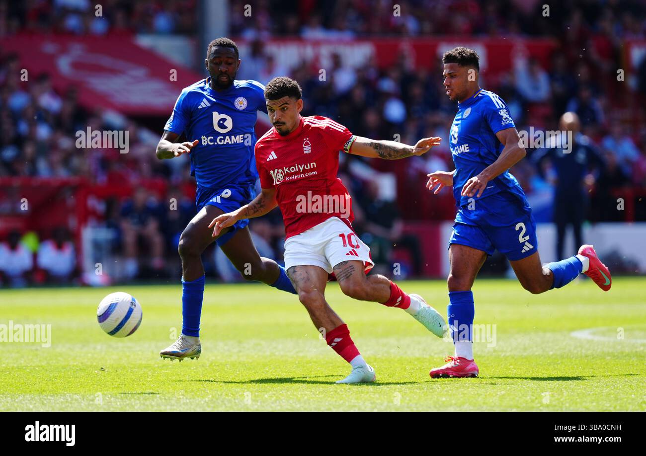 Nottingham Forest's Morgan Gibbs-White (centre) in action with Leicester City's Wilfred Ndidi ...