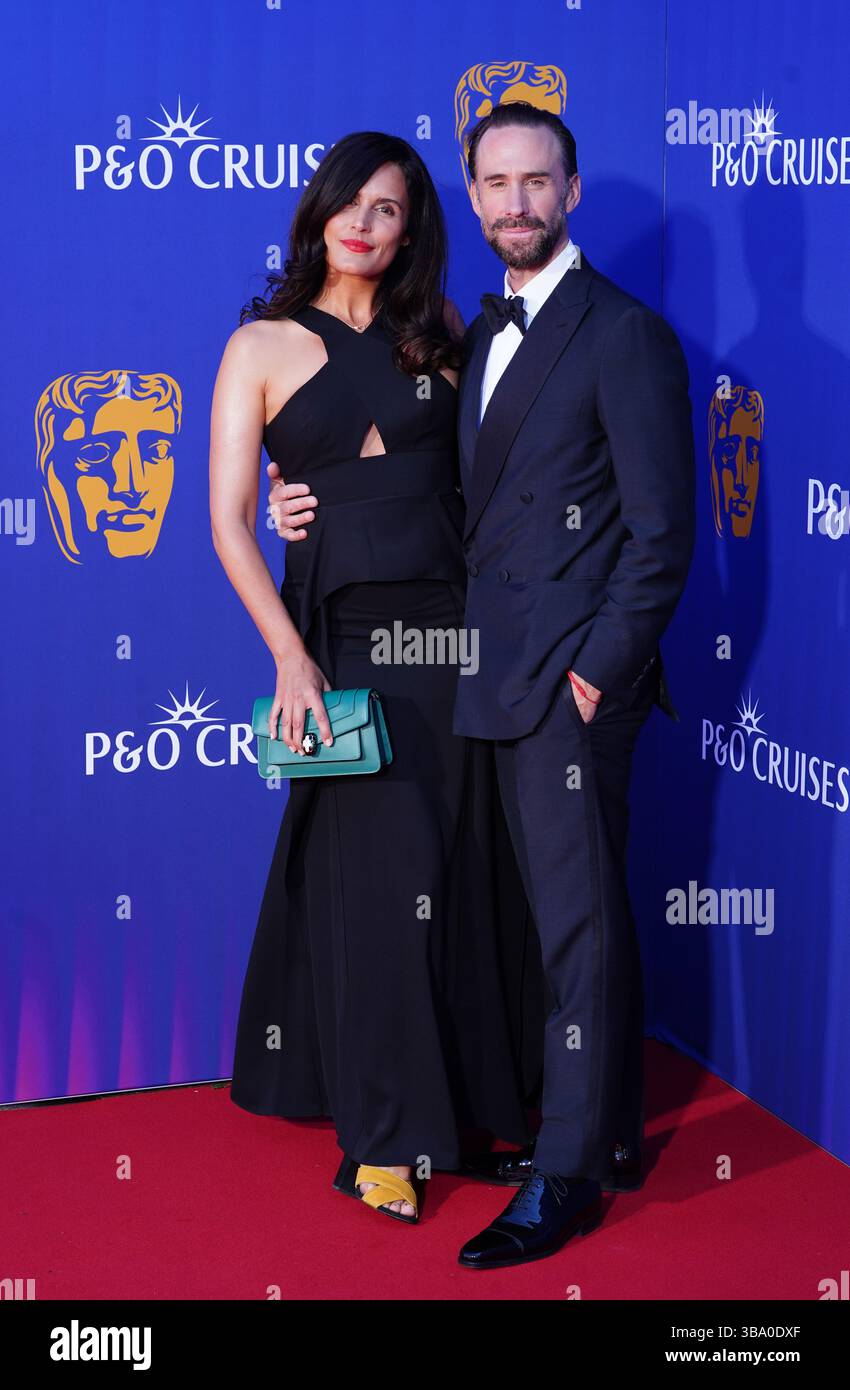 Maria Dolores Dieguez and Joseph Fiennes attending the 2025 BAFTA ...