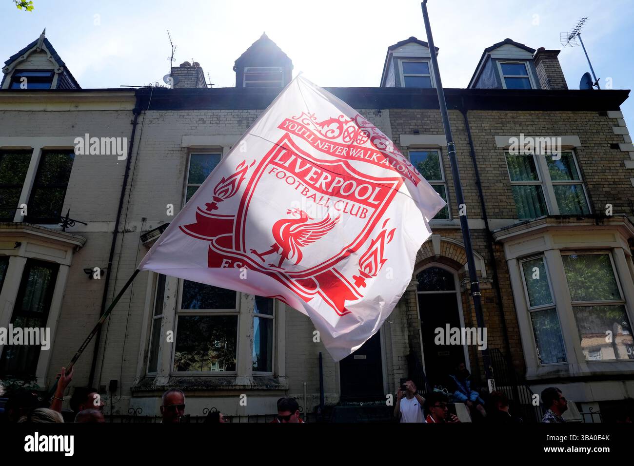 A Liverpool fan flying a flag near the stadium ahead of the Premier ...