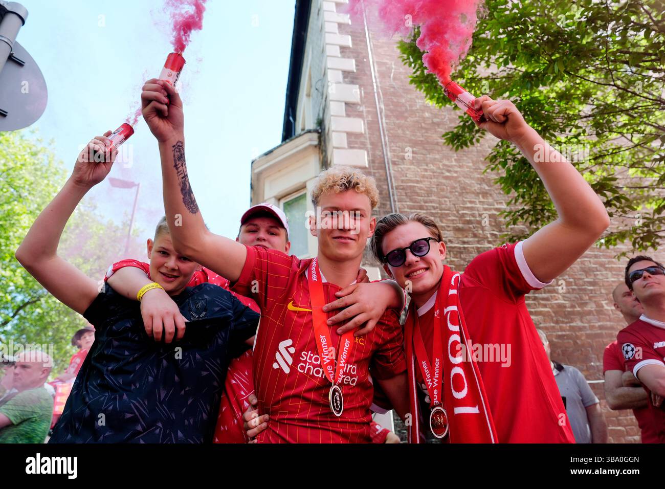 Liverpool fans let off flares near the stadium ahead of the Premier ...