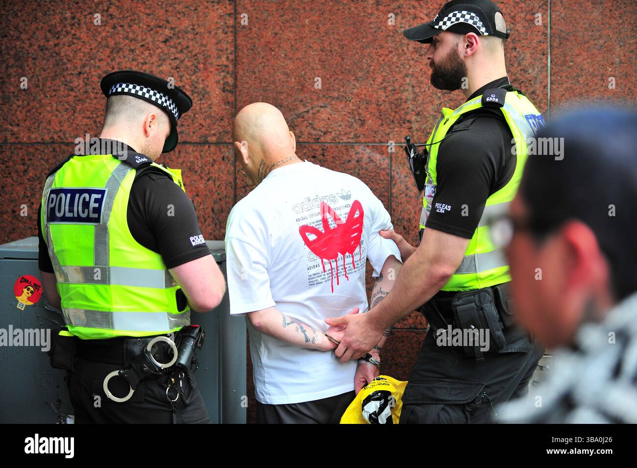 Glasgow, UK. 11th May, 2025 - A man is seen being arrested by Police ...