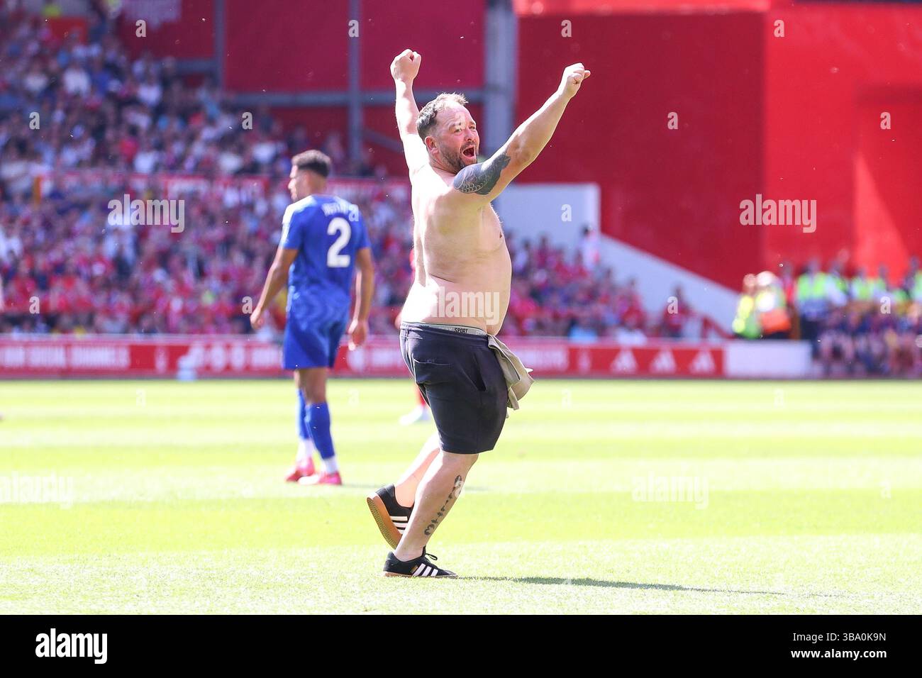Nottingham, UK. 11th May, 2025. A Leicester City pitch invader runs on ...