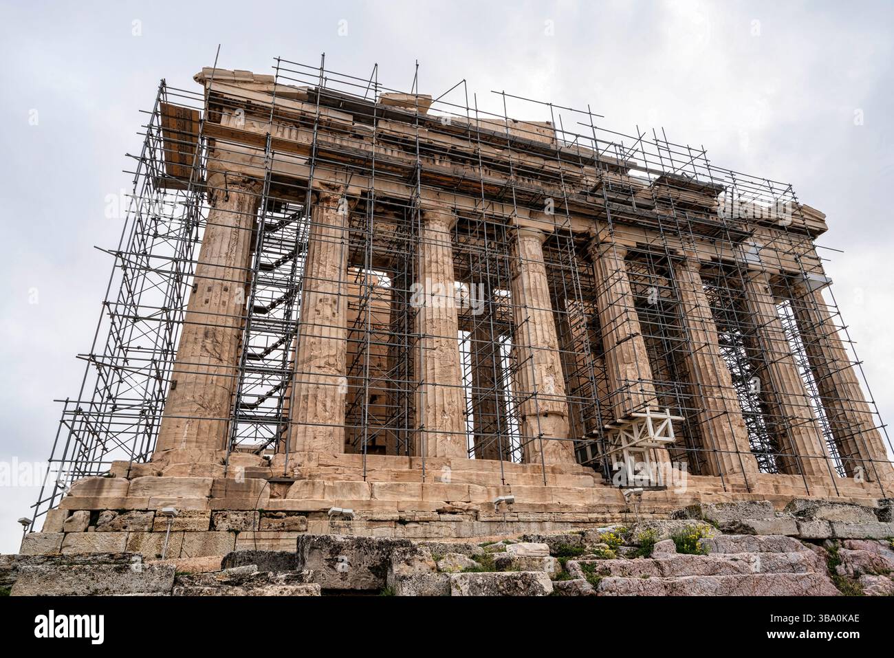 Frontal view of the Parthenon temple on the Acropolis in Athens, fully surrounded by scaffolding ...