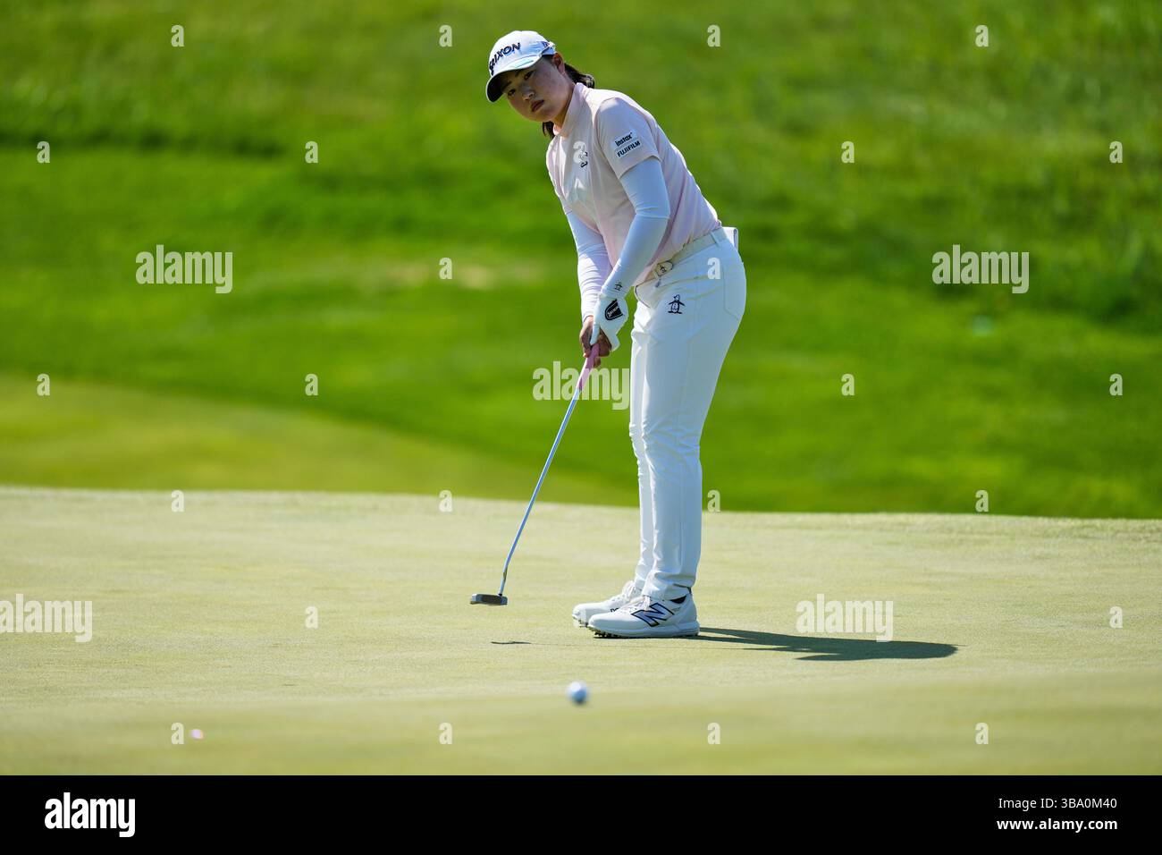 Rio Takeda, of Japan, putts on the 3rd green during the final round of ...