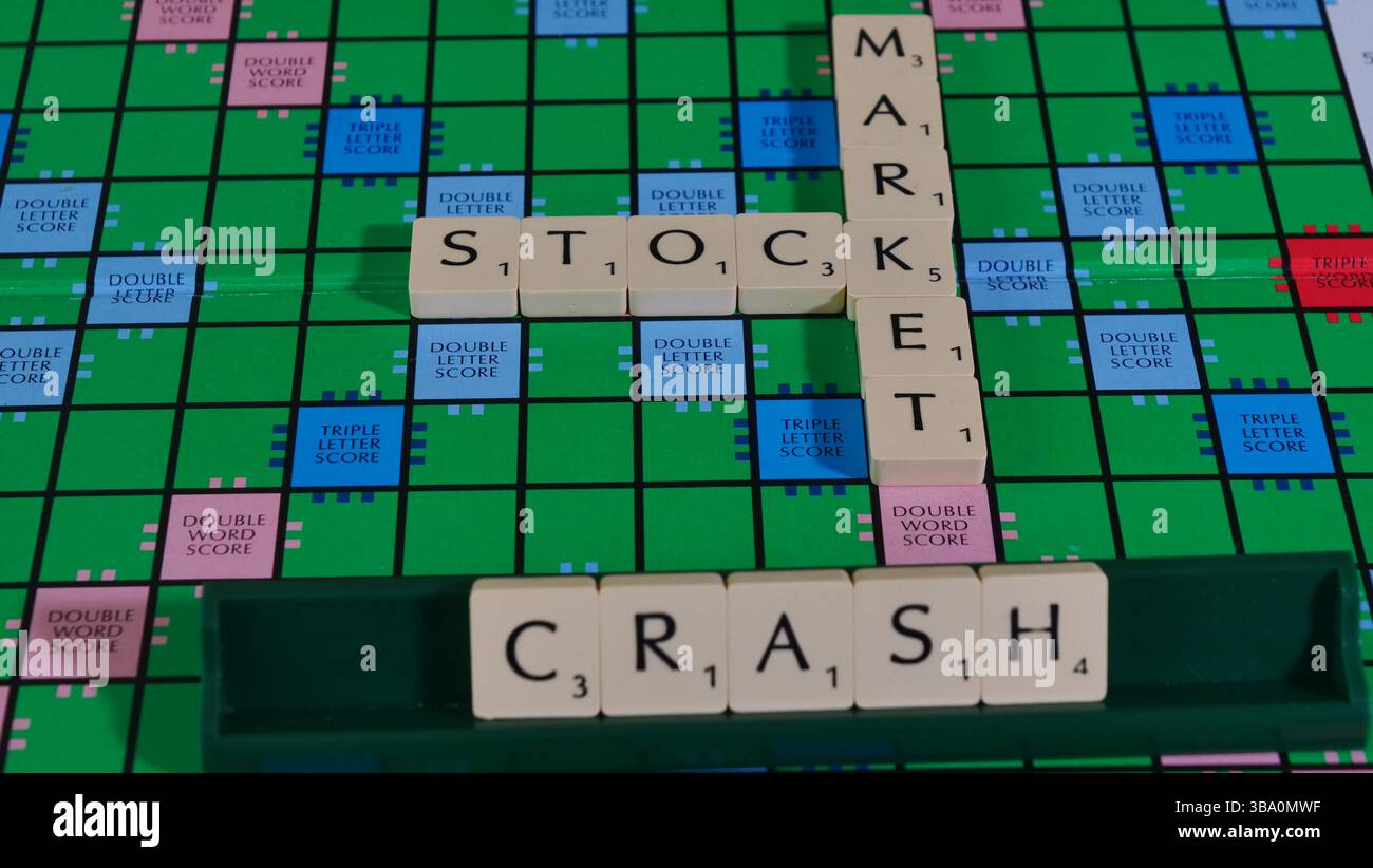 The concept of a stock market crash illustrated by words on a scrabble ...