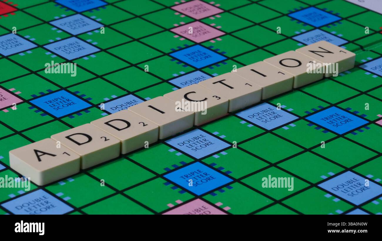 The word Addiction and Addict is spelled out on a Scrabble board Stock ...