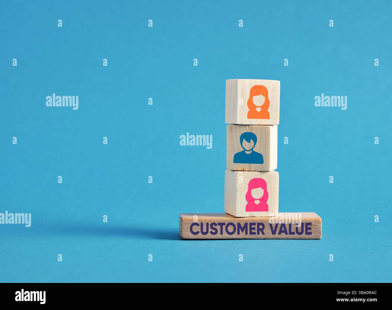 Customer value concept is represented by wooden cubes with icons over ...