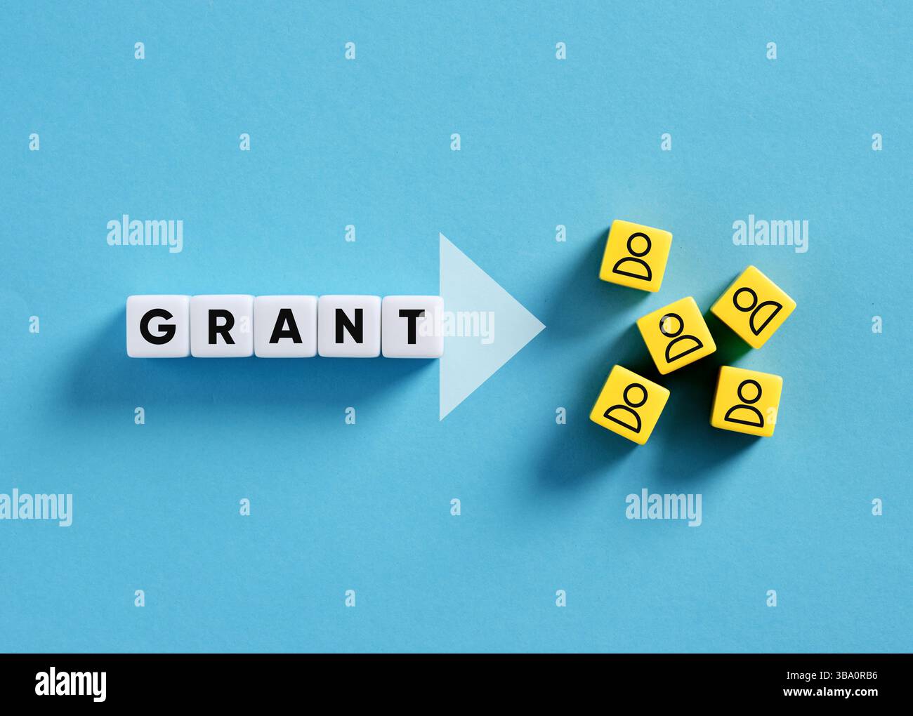 Grant funding concept with an arrow pointing at a group of cubes with ...