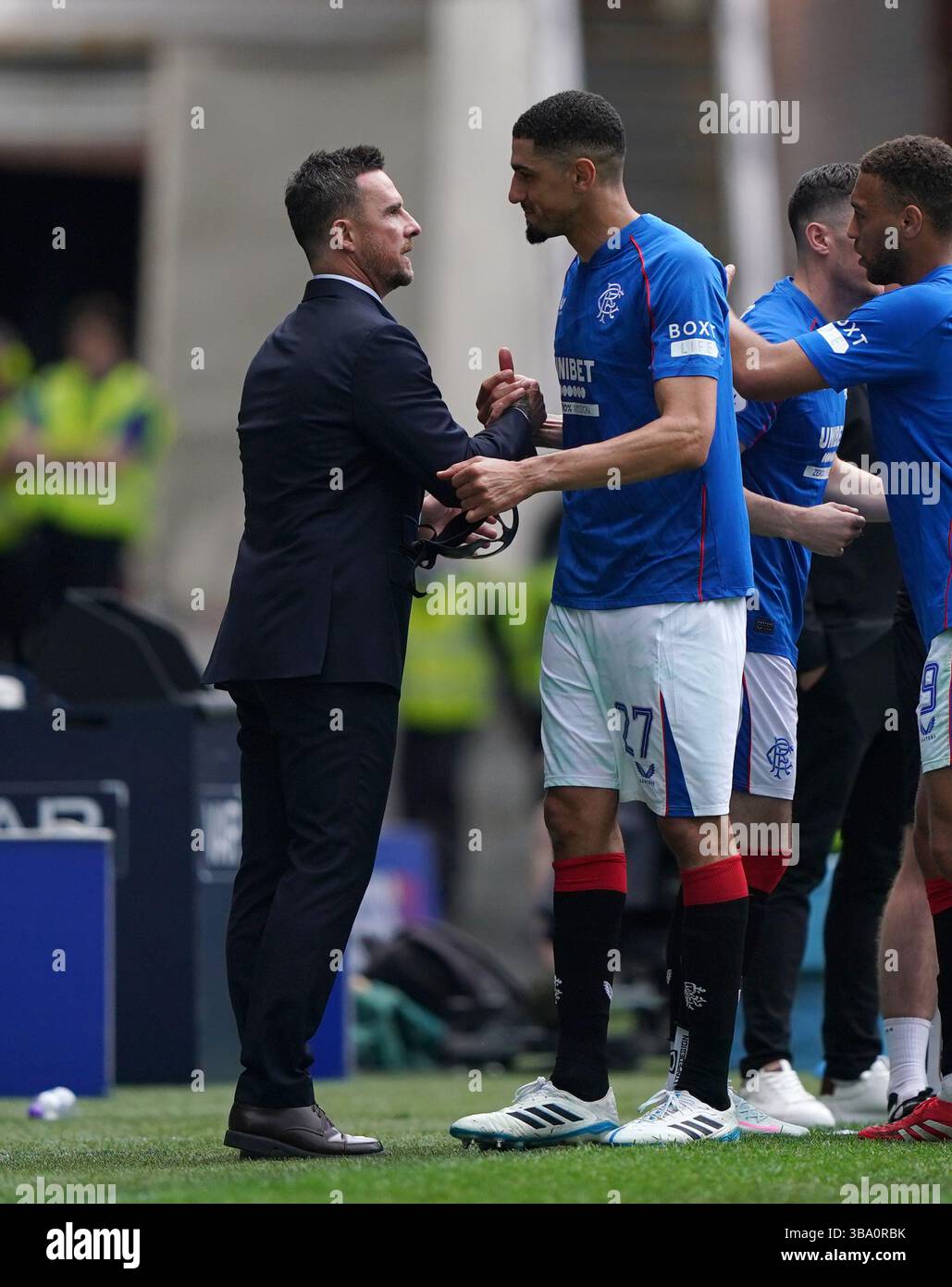 Rangers' Leon Balogun with interim manager Barry Ferguson as he leaves ...