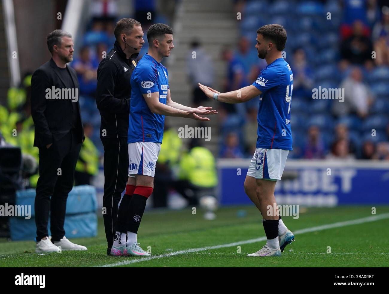 Rangers' Nicolas Raskin (right) is replaced by team-mate Tom Lawrence ...