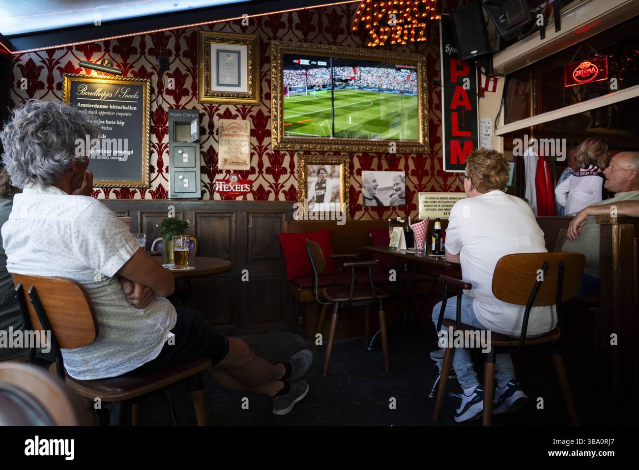 AMSTERDAM - Ajax fans follow the premier league match between Feyenoord ...