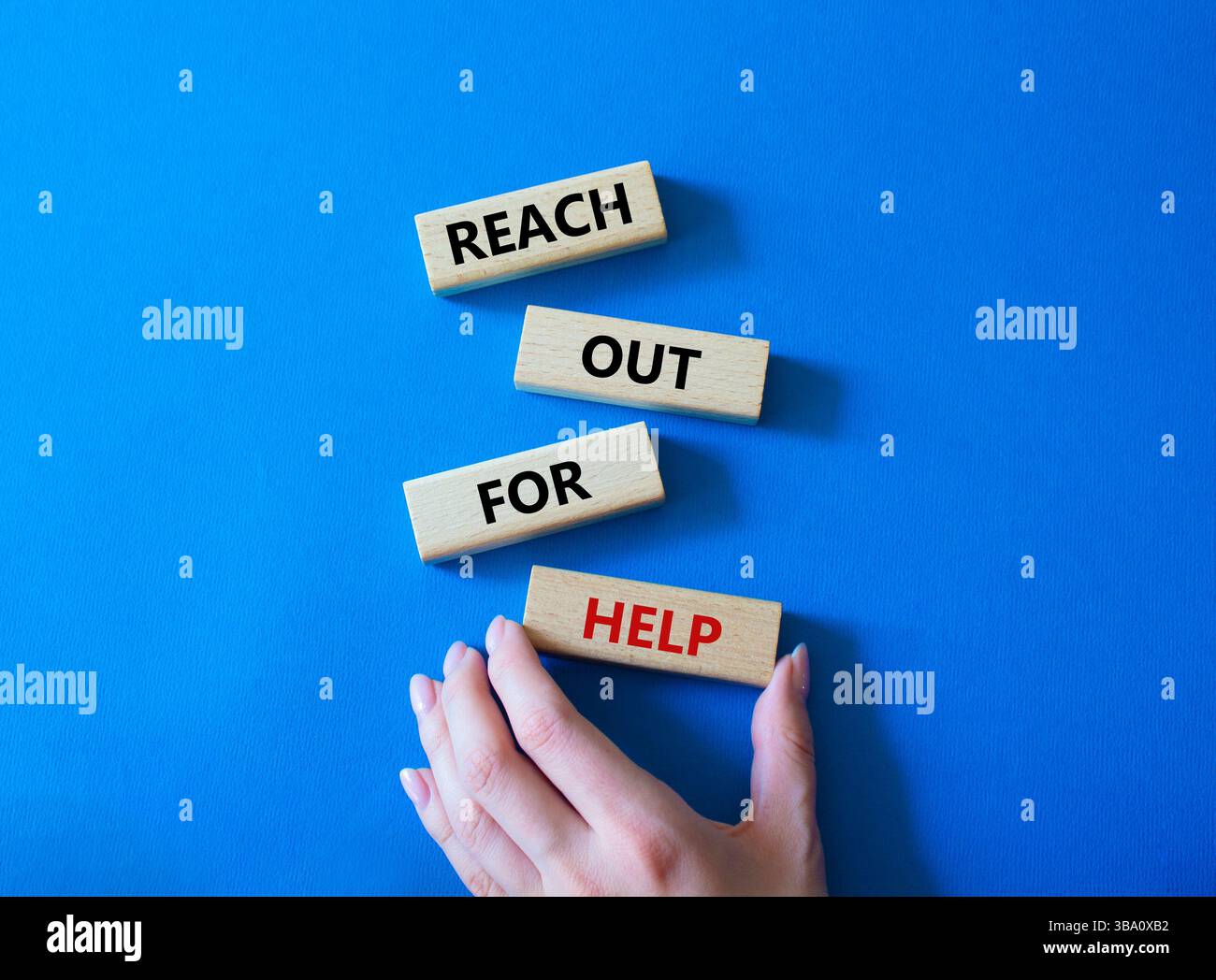 Reach out for help symbol. Wooden blocks with words Reach out for help ...