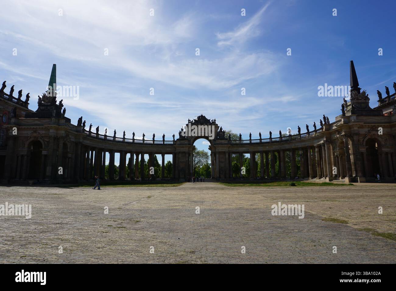Frontal view of the ornate Baroque Communs and colonnade of Neues ...
