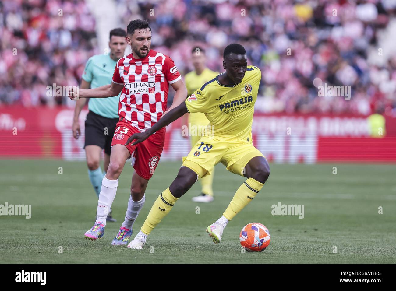 Pape Gueye of Villarreal CF and Ivan Martin of Girona FC during the ...