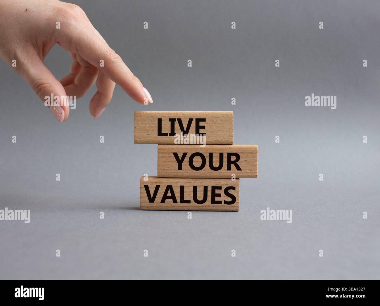 Live your values symbol. Concept words 'Live your values' on wooden blocks. Beautiful grey ...