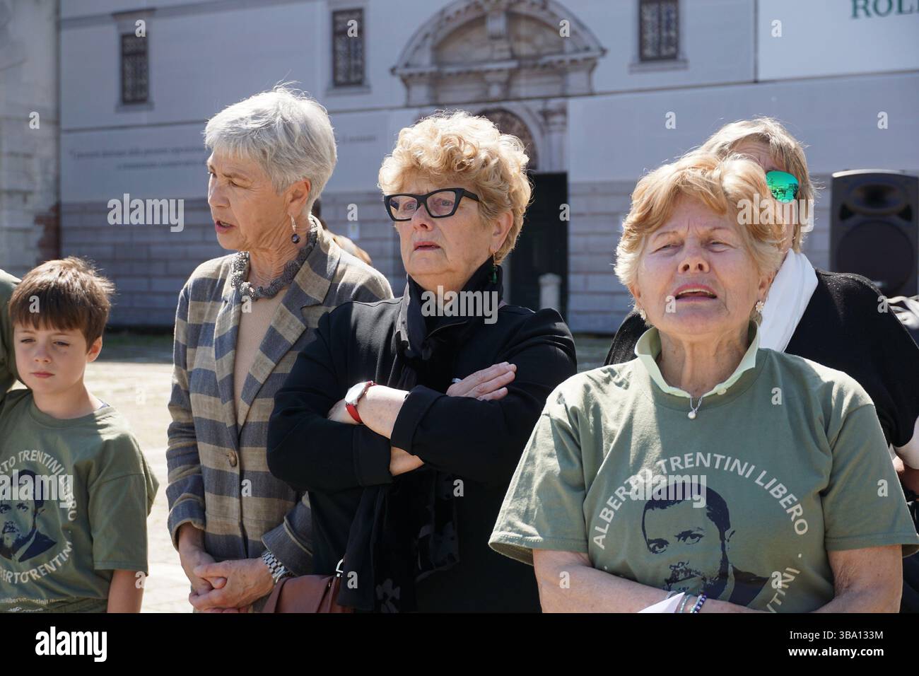 Alberto Trentini's mother, Armanda Colusso, (in the center, in a dark ...