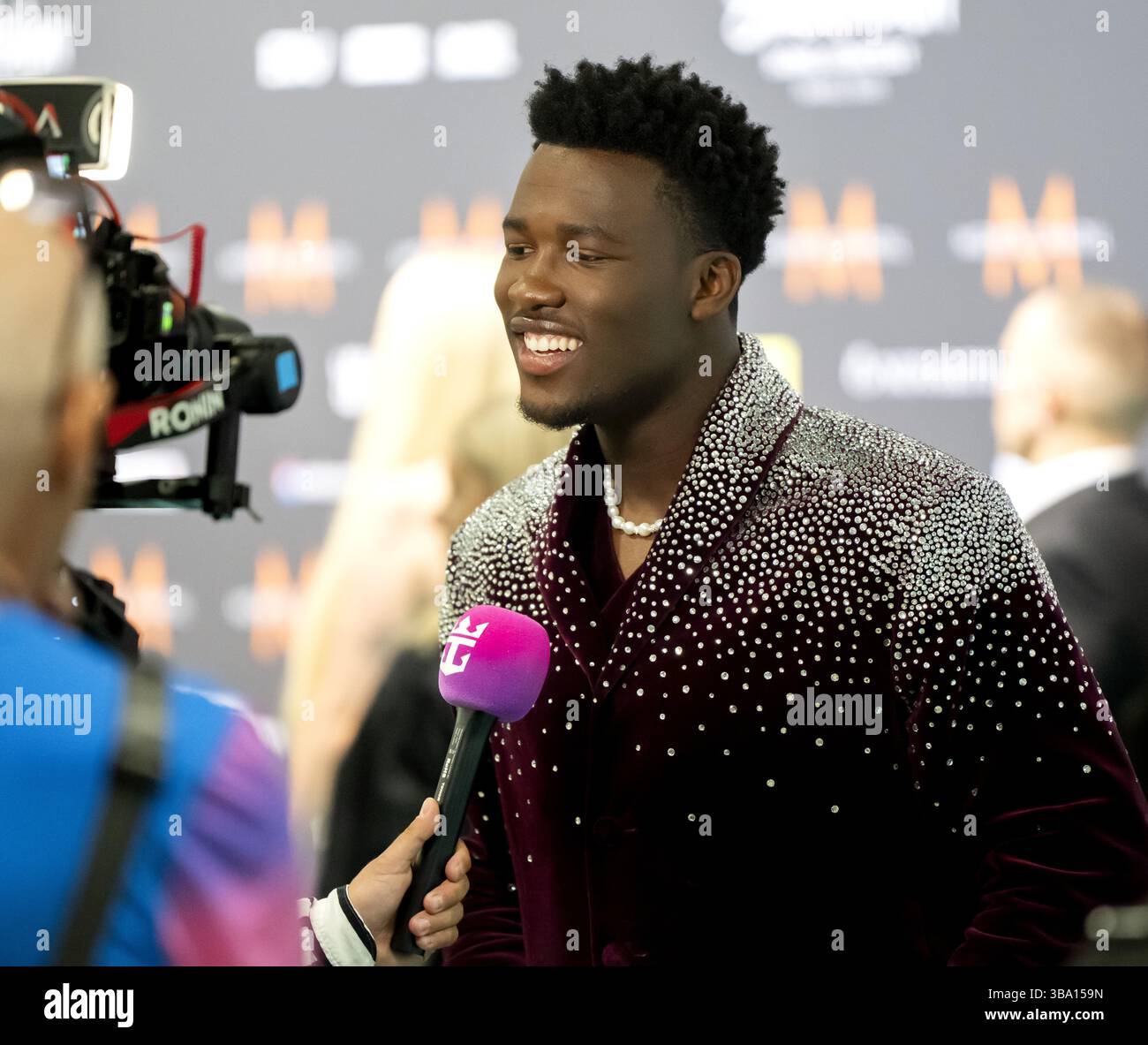 BASEL - Claude is interviewed on the turquoise carpet during the ...
