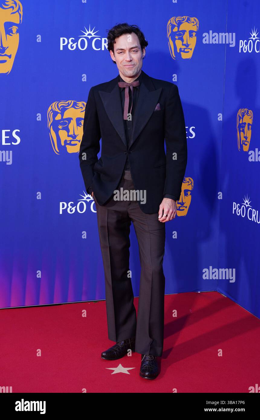 Alex Hassell attending the 2025 BAFTA Television Awards with P&O ...