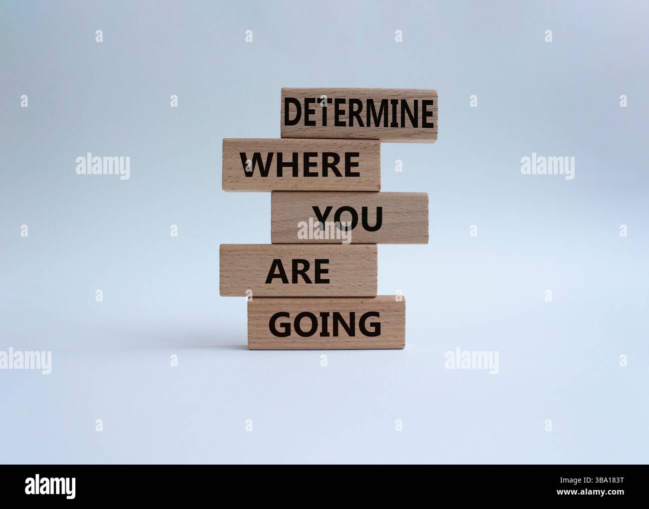 Determination symbol. Wooden blocks with words Determine where you are ...