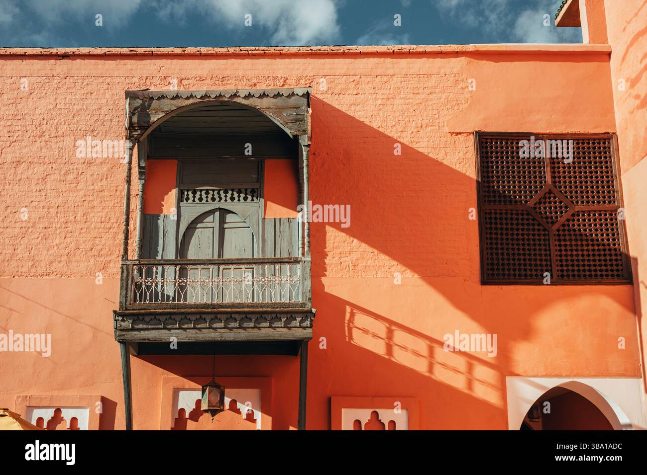 Sunlight illuminating a traditional Moroccan balcony and casting ...