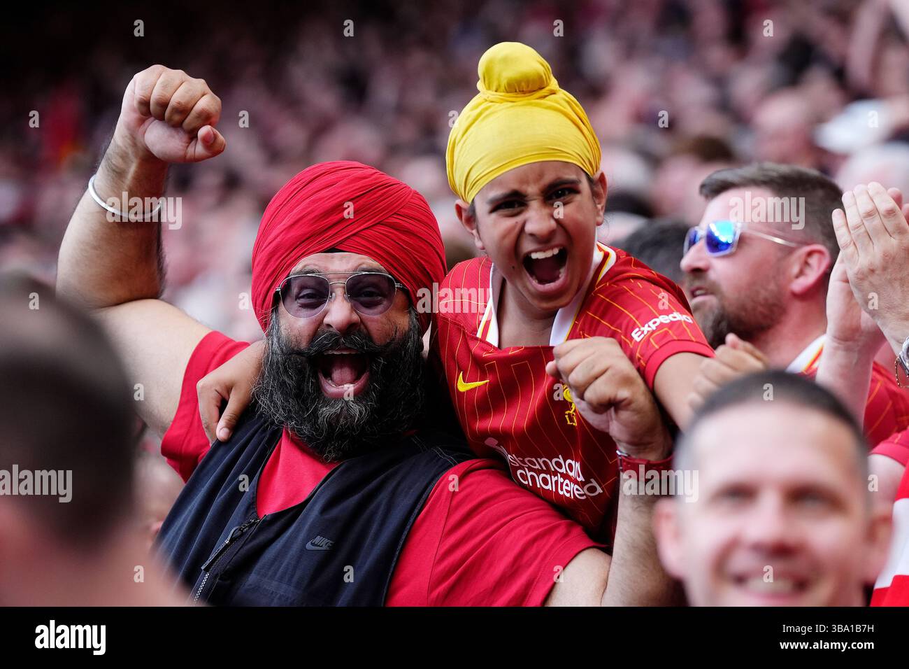 Liverpool fans celebrate during the Premier League match at Anfield ...