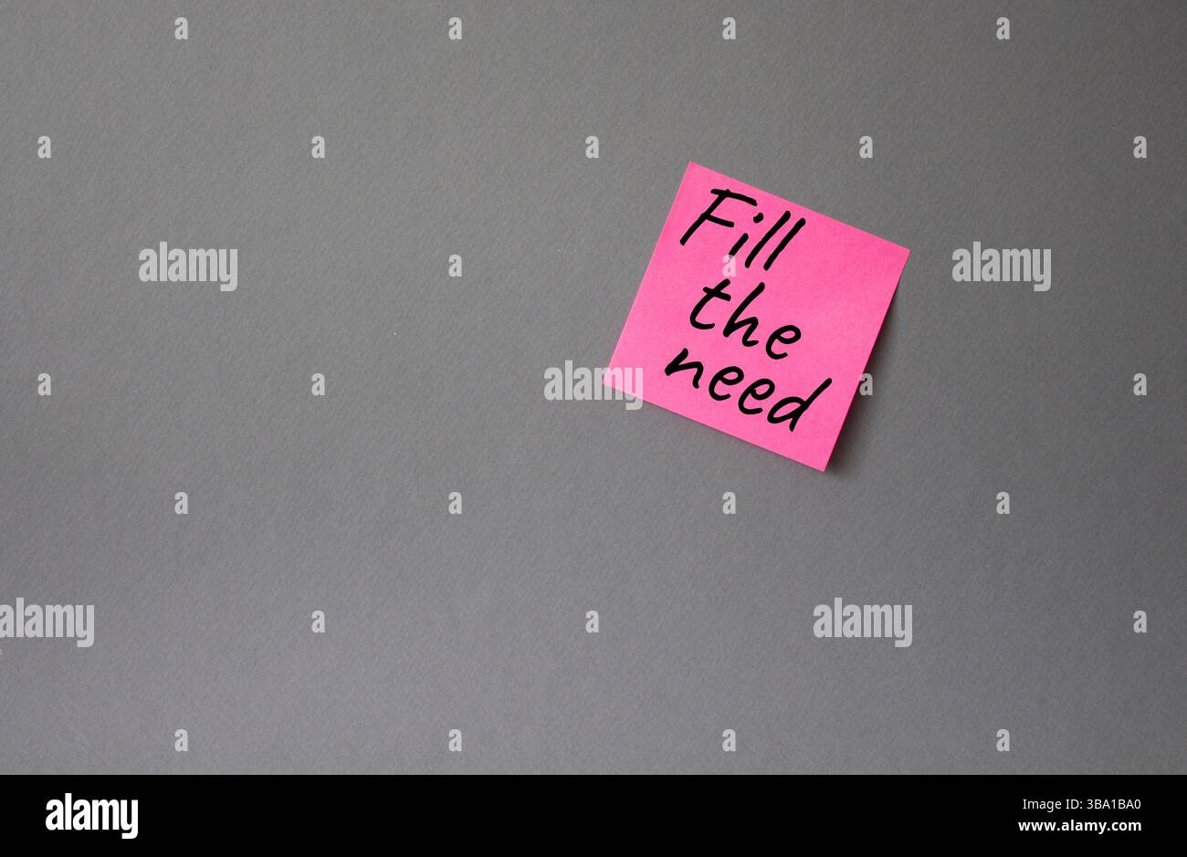 Fill the need symbol. Concept word Fill the need on steaky pink note ...