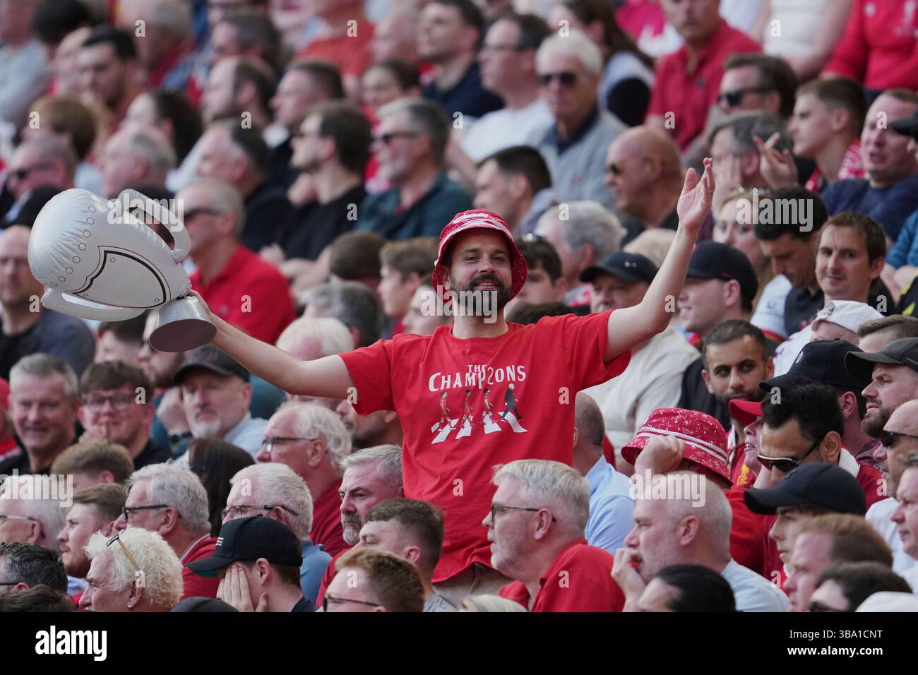 A Liverpool fan celebrates during the English Premier League soccer ...