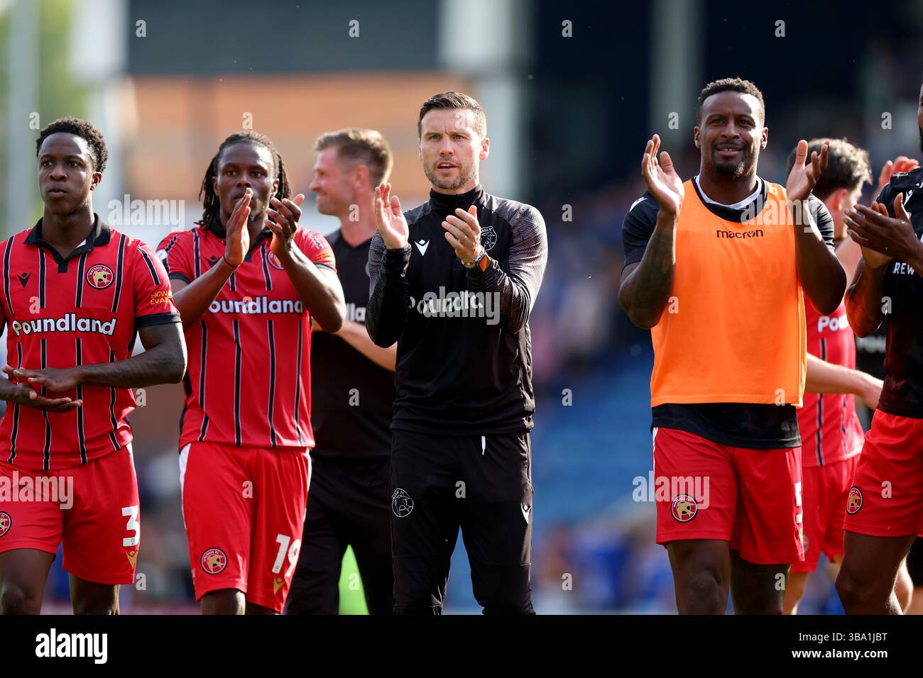Walsall's manager Mat Sadler and his players acknowledge the crowd at ...