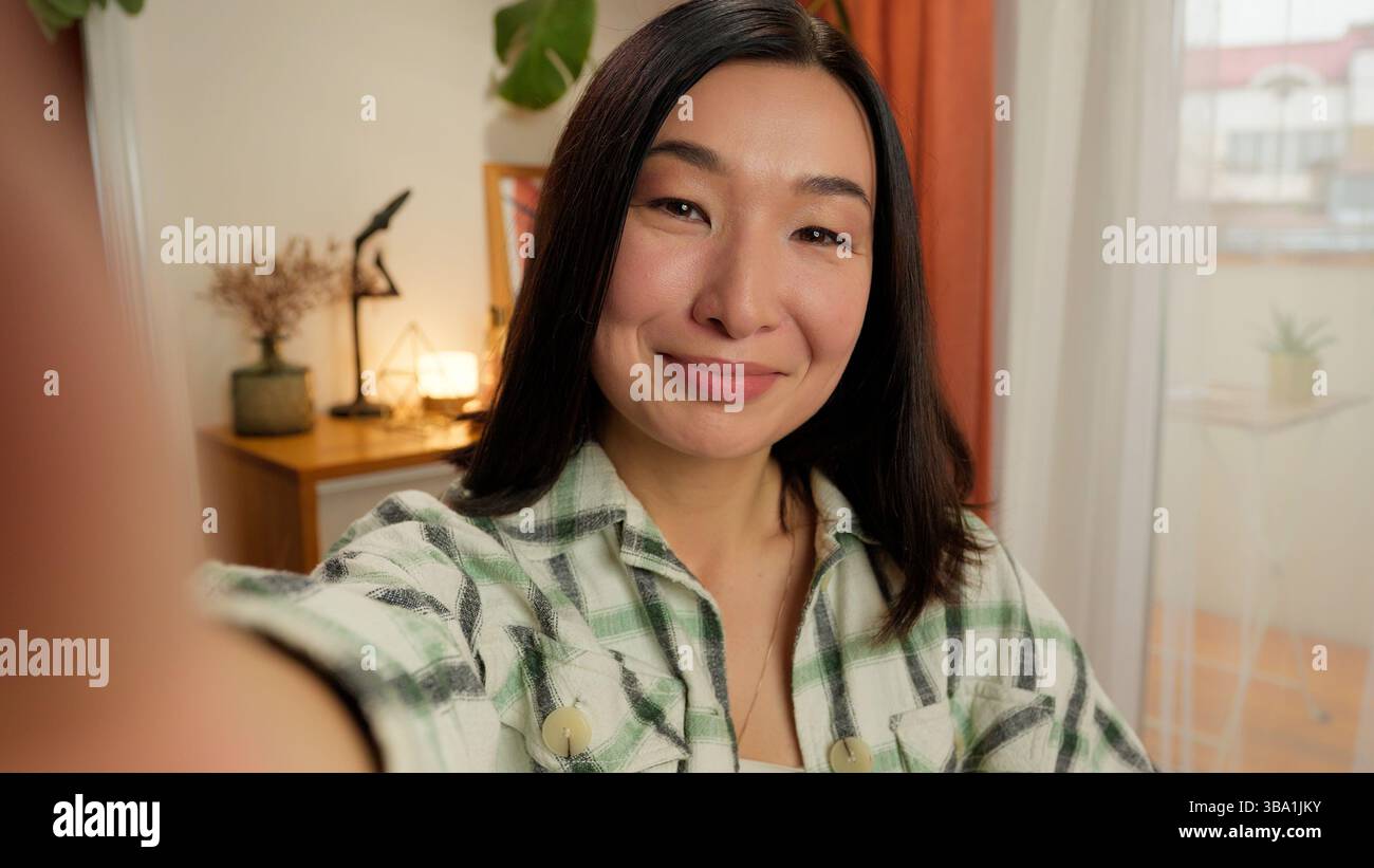 Web camera view Asian Korean woman video call blog waving hand greeting ...