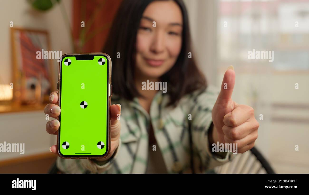 Asian Korean Chinese Japanese woman showing at camera screen mobile ...