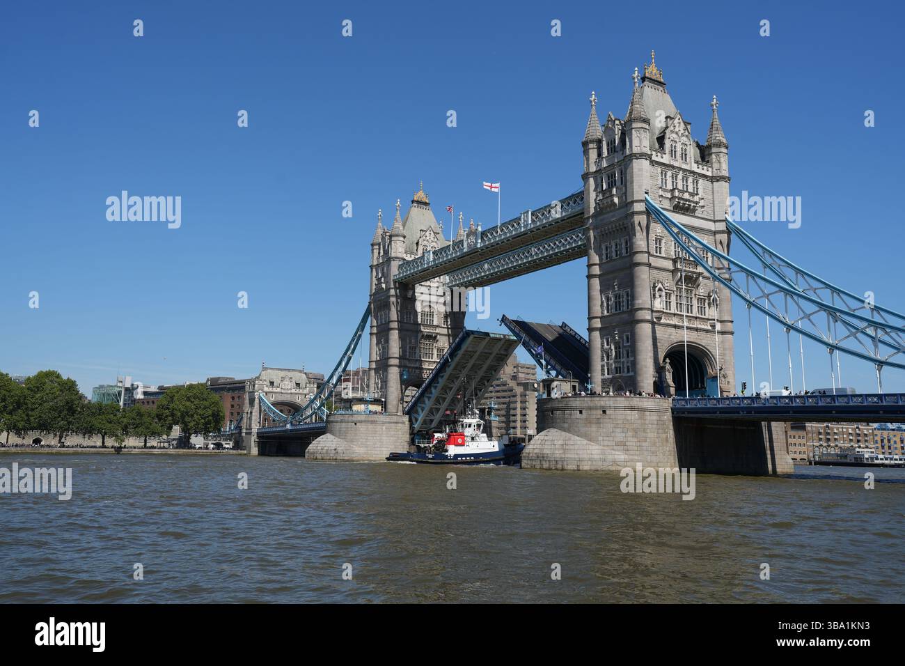 Tower Bridge London with Tugboat, Raised Bridge Stock Photo - Alamy