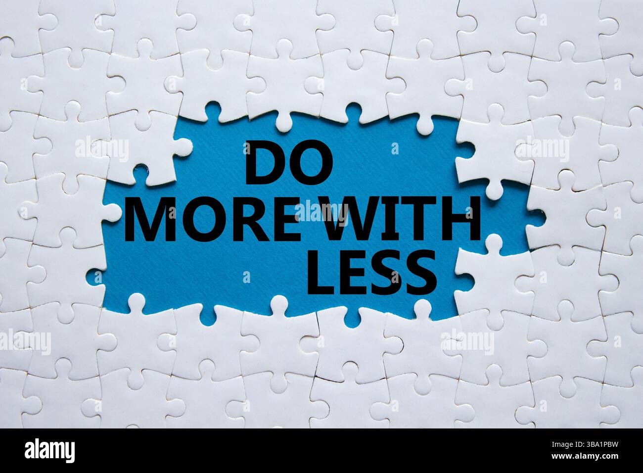Do more with less symbol. Concept words Do more with less on white puzzle. Beautiful blue ...