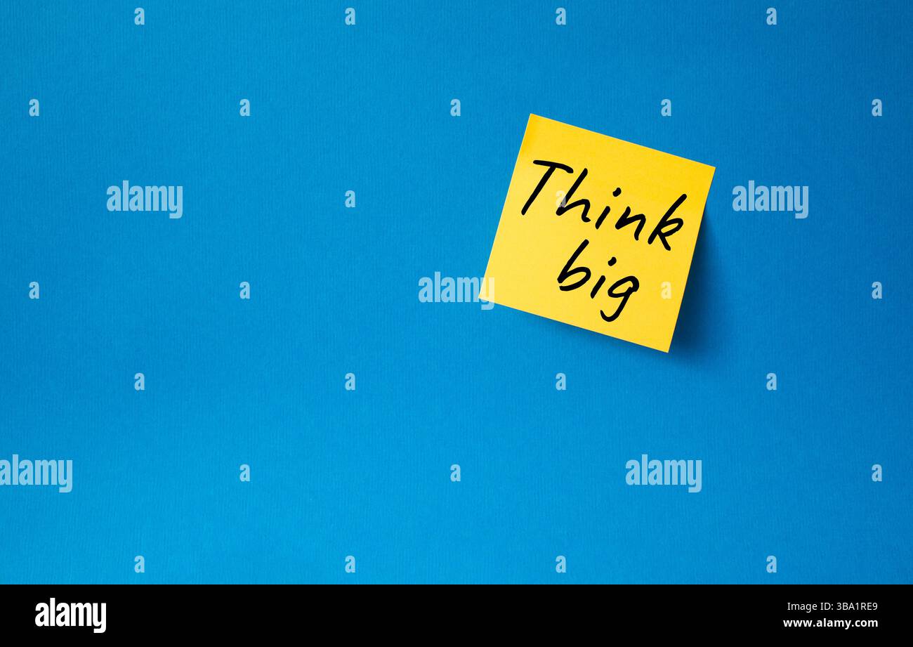 Think big symbol. Orange steaky note with words Think big. Beautiful ...