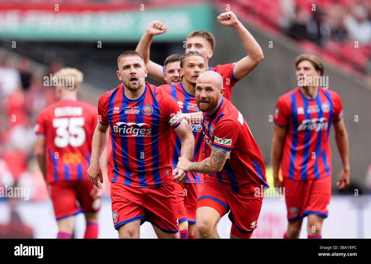 Aldershot Town's Josh Barrett (left) celebrates with his team mates ...