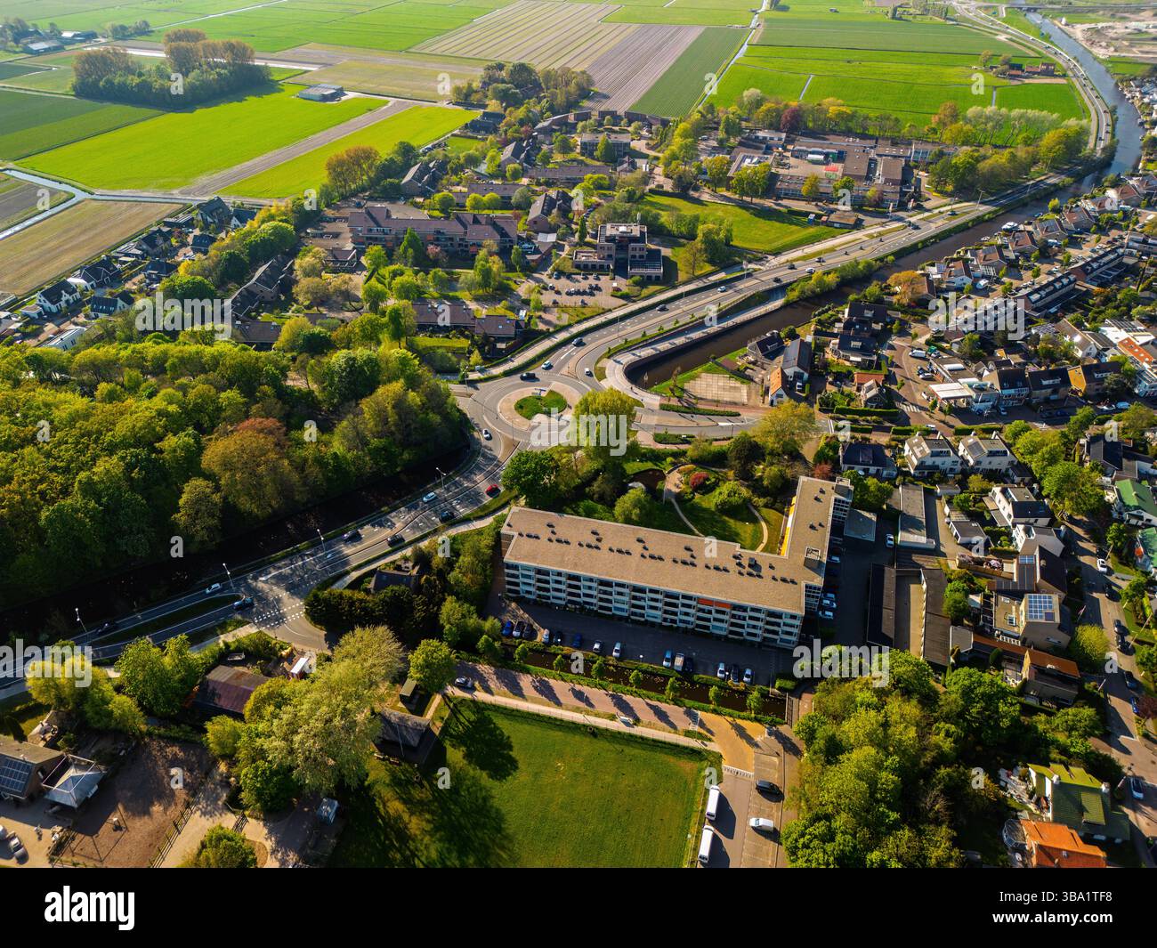 Aerial view of a peaceful suburban neighborhood with tree-lined streets ...